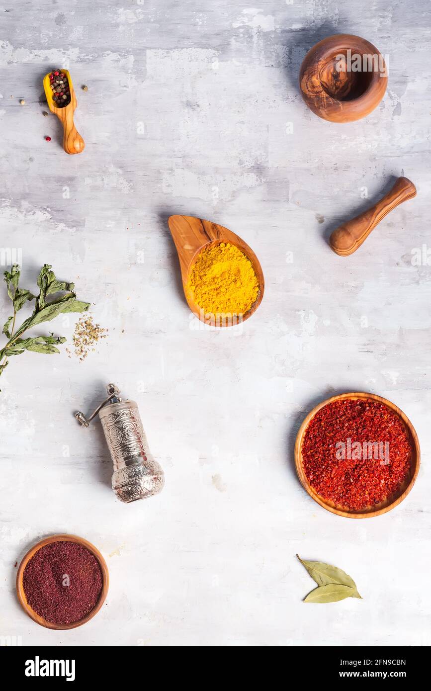 Dried kinds of spices of different grinding in wooden bowl with handle ...