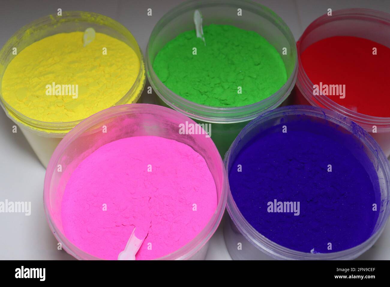 multiple colored powder stock on plastic pot for holiday Stock Photo ...
