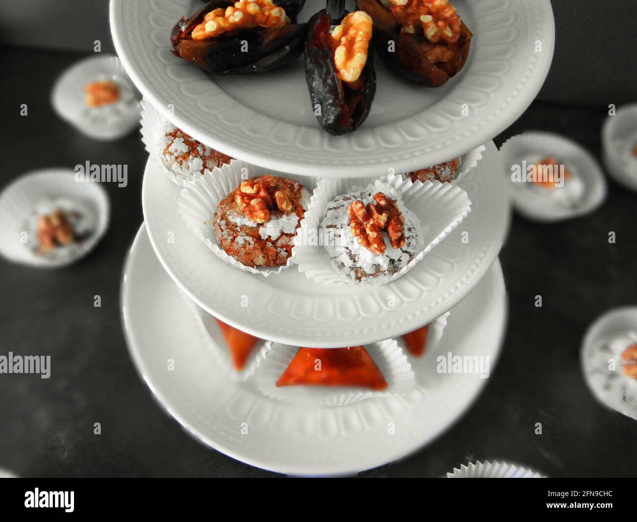 High angle shot of sweets assortment on a 3-tier plate Stock Photo - Alamy