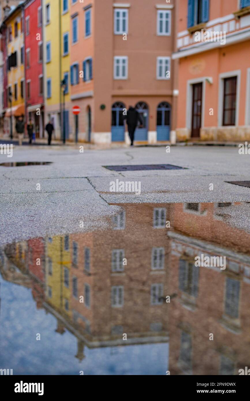 Vertical shot of a street in Rovinj, Croatia with colorful buildings ...