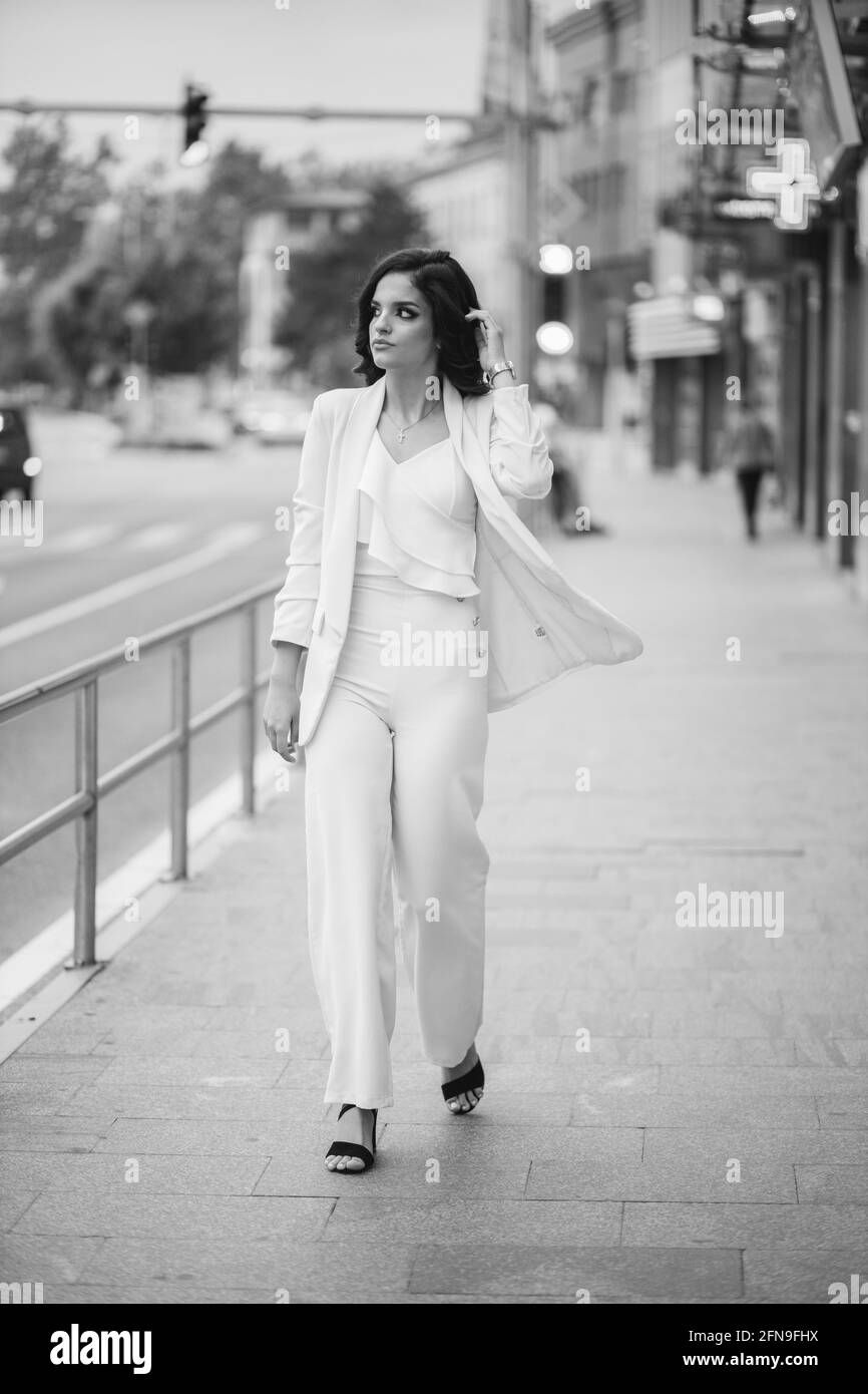 Elegant fashion model walking Black and White Stock Photos & Images - Alamy