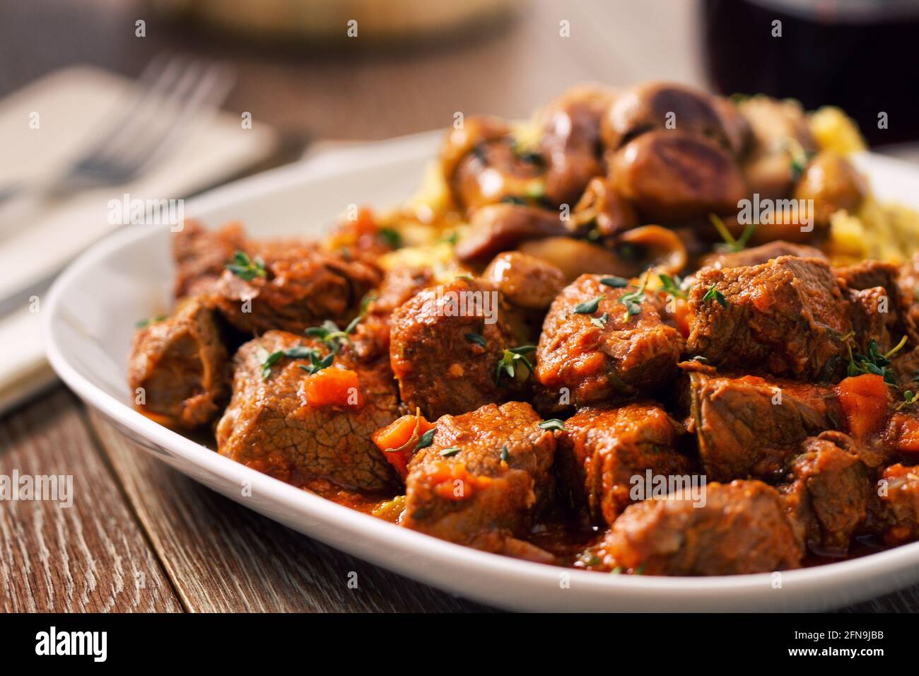 Polenta and beef stew on a plate. High quality photo Stock Photo - Alamy