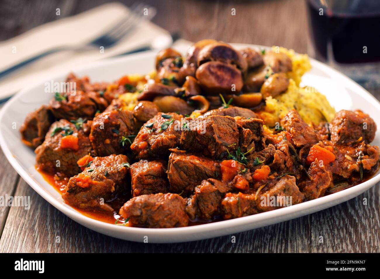 Polenta and beef stew on a plate. High quality photo Stock Photo - Alamy