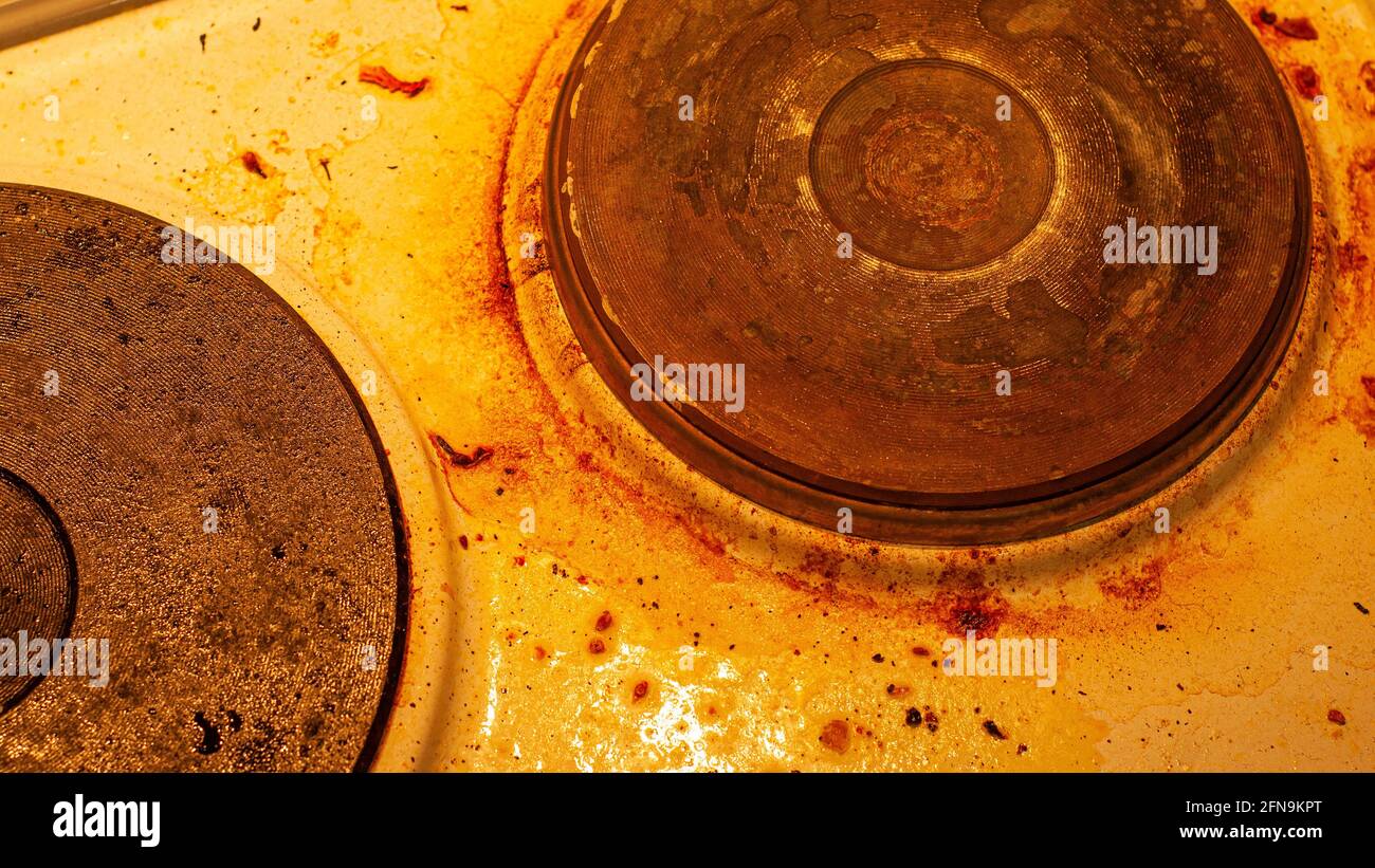 A very dirty and old cooker with grease stains and burnt food Stock ...