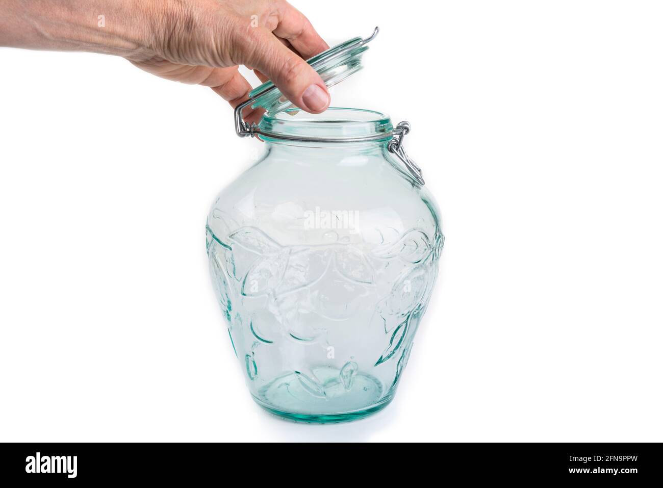 The clear empty jar with a lid on a white Stock Photo - Alamy