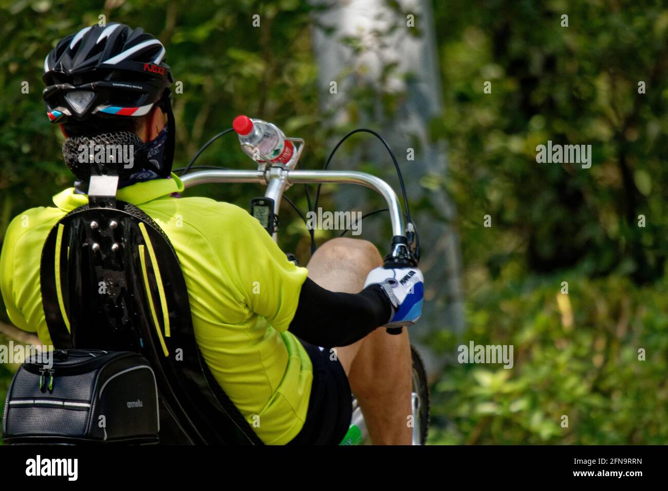 unusual cycle lying down in public park, daytime from rear Stock Photo ...
