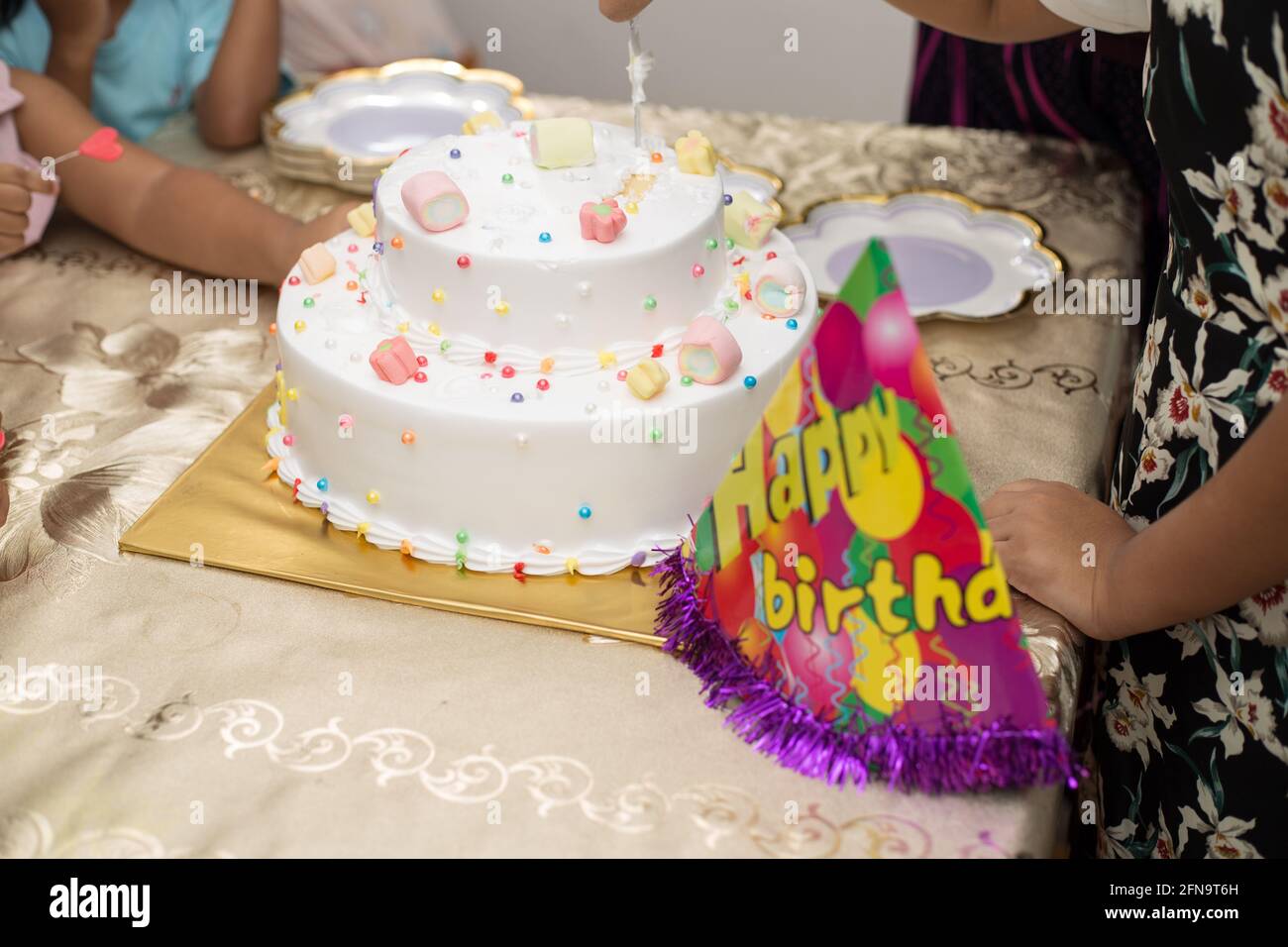 Child cutting birthday cake hi-res stock photography and images - Alamy