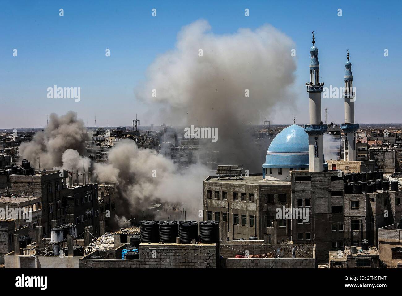Rafah, Palestinian Territories. 15th May, 2021. Smoke rises behind a ...