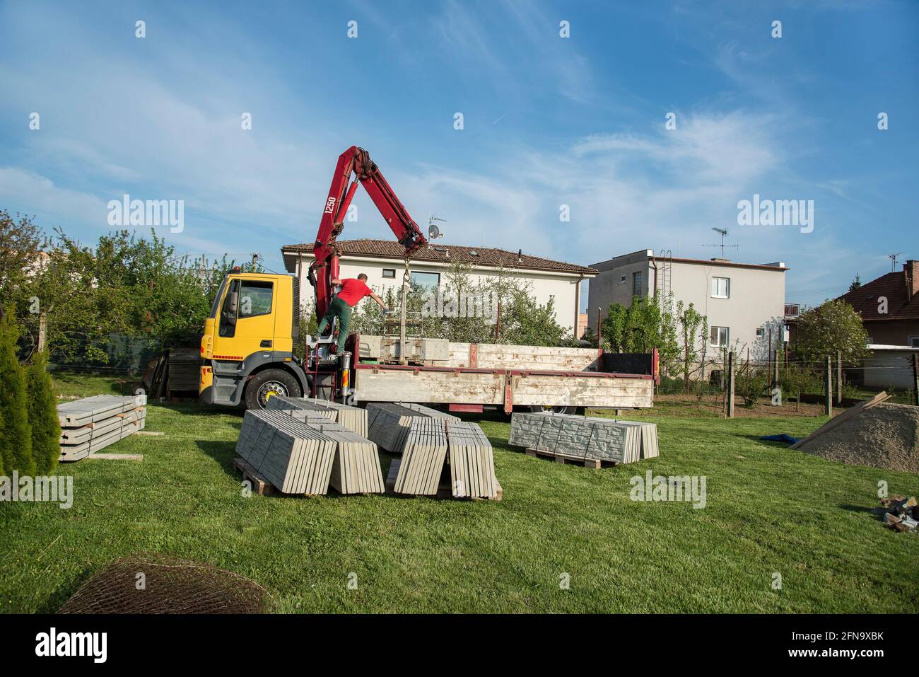 Construction crane lifting pallet building hi-res stock photography and ...
