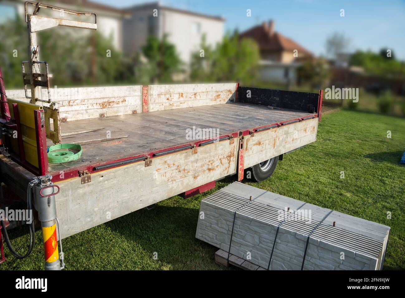 Unloading pallet from the truck with a crane Stock Photo - Alamy