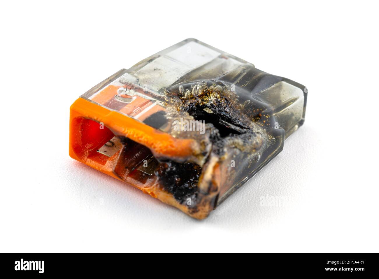 Burnt quick coupler for electric cables with three inputs, isolated on ...