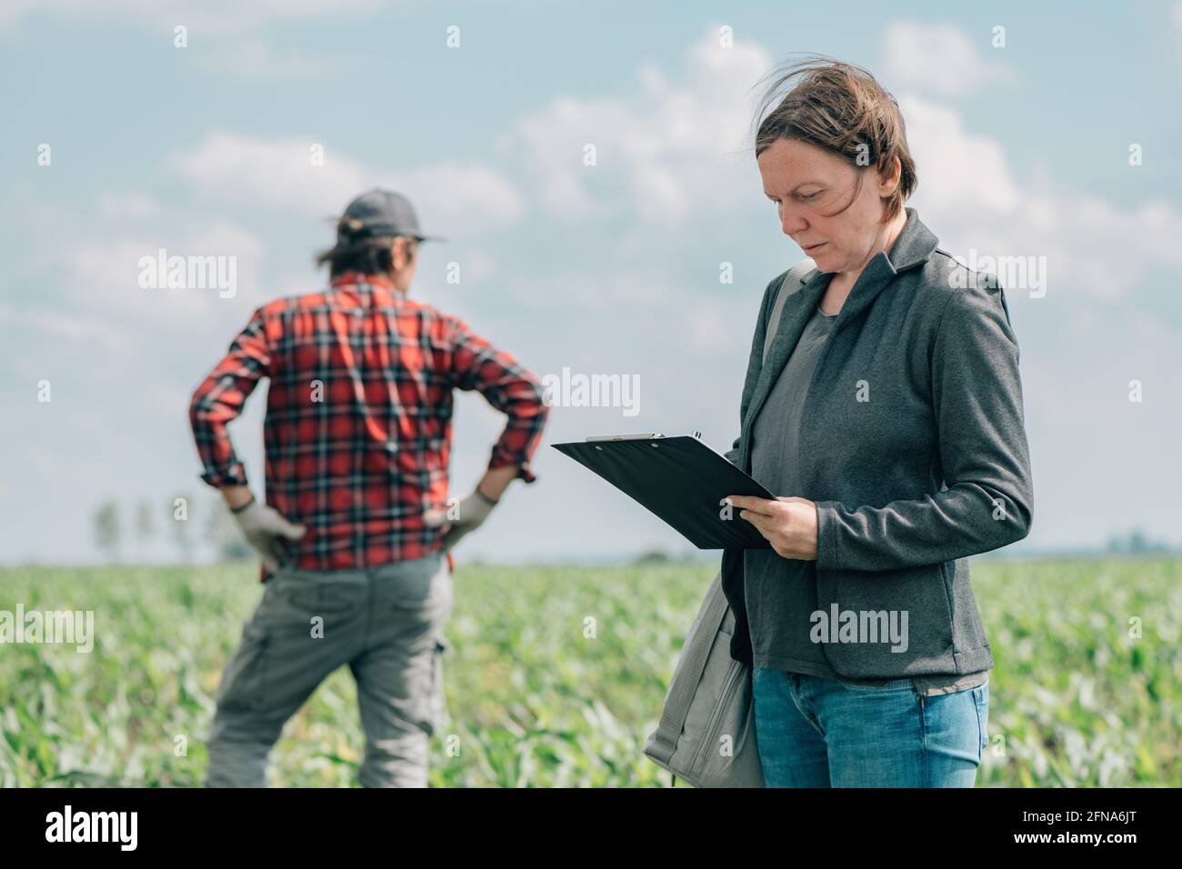 Mortgage loan officer assisting farmer in financial allowance ...