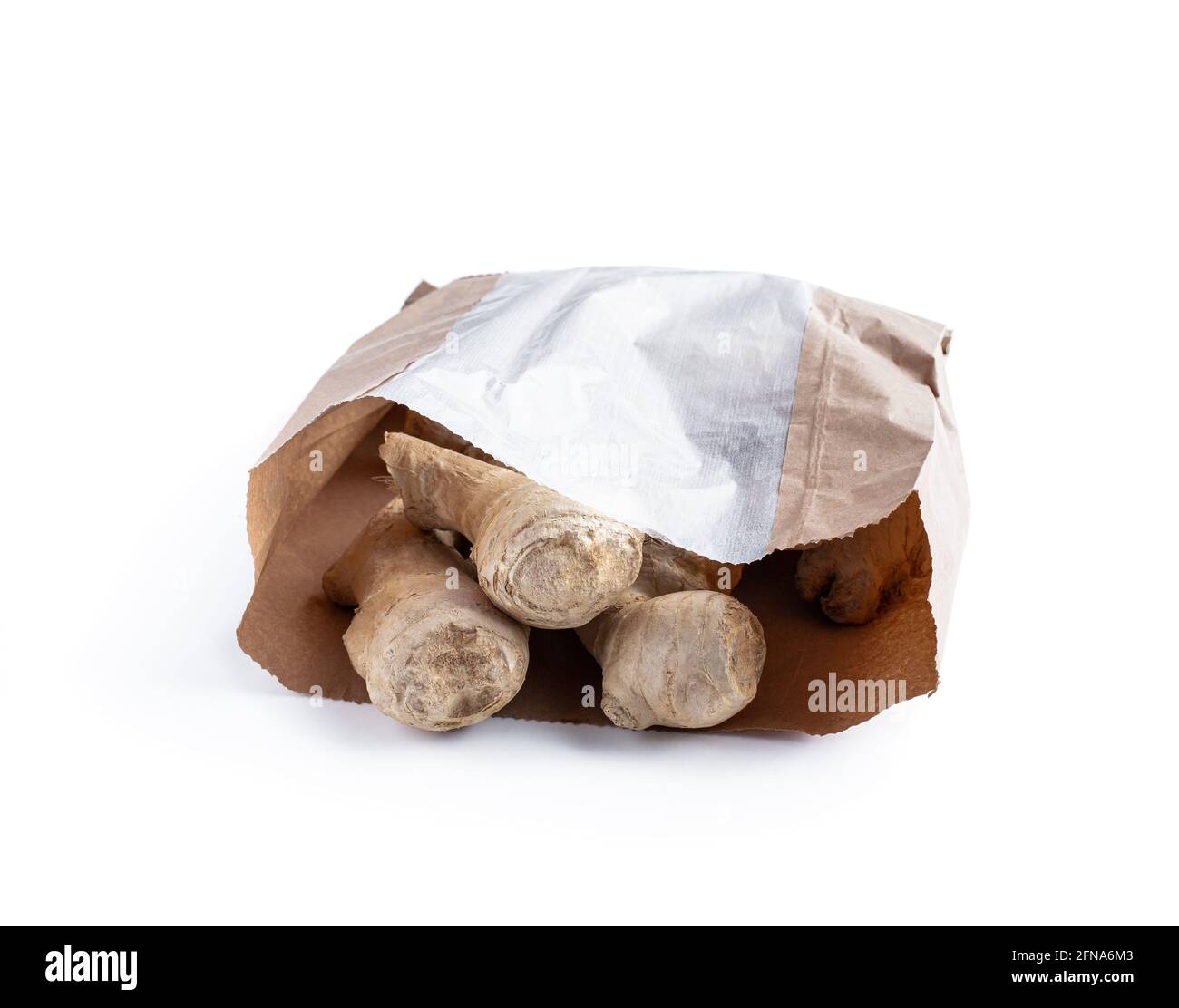 Fresh ginger roots in paper bag isolated on white Stock Photo - Alamy