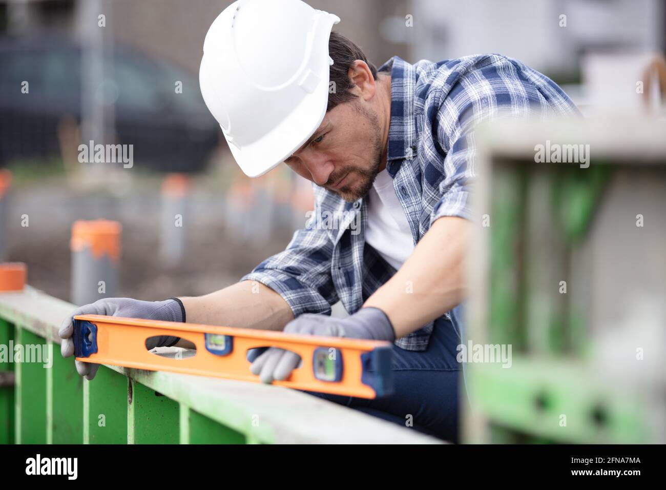 civil engineer leveling with a spirit level Stock Photo - Alamy