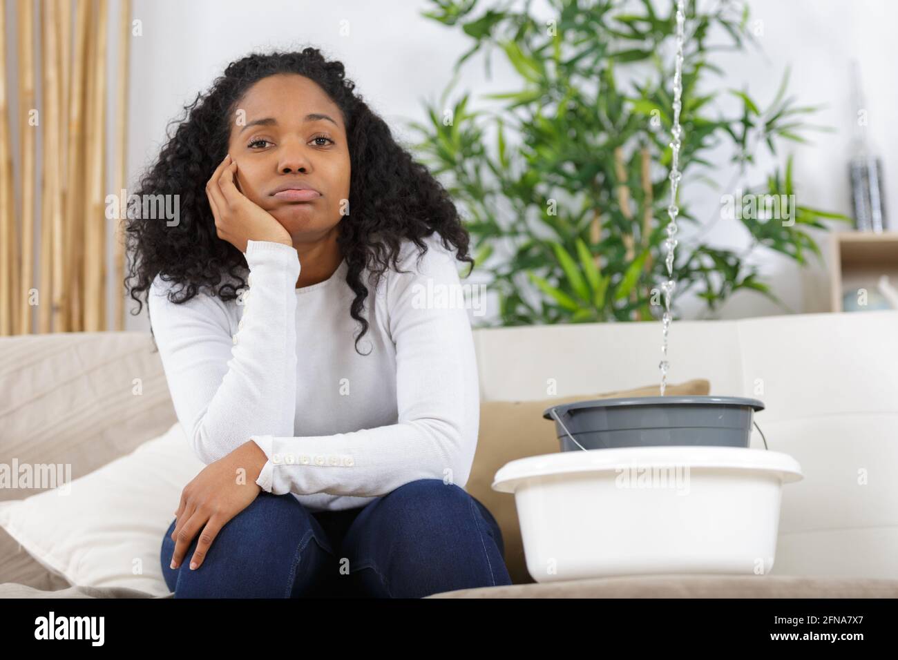 sad homeowner with a bad insurance concept Stock Photo - Alamy