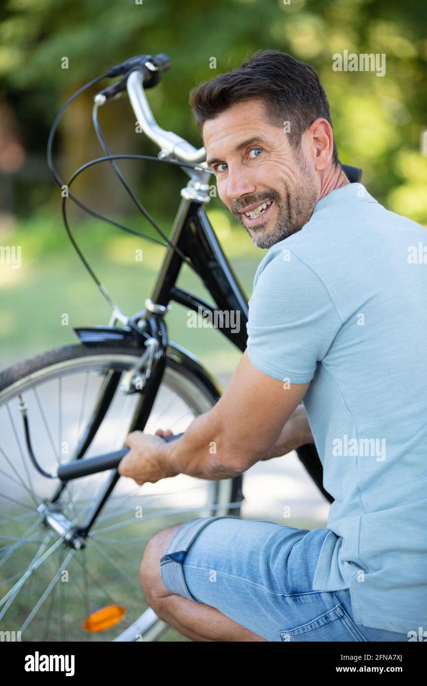 Cyclist looking over shoulder hi-res stock photography and images - Alamy