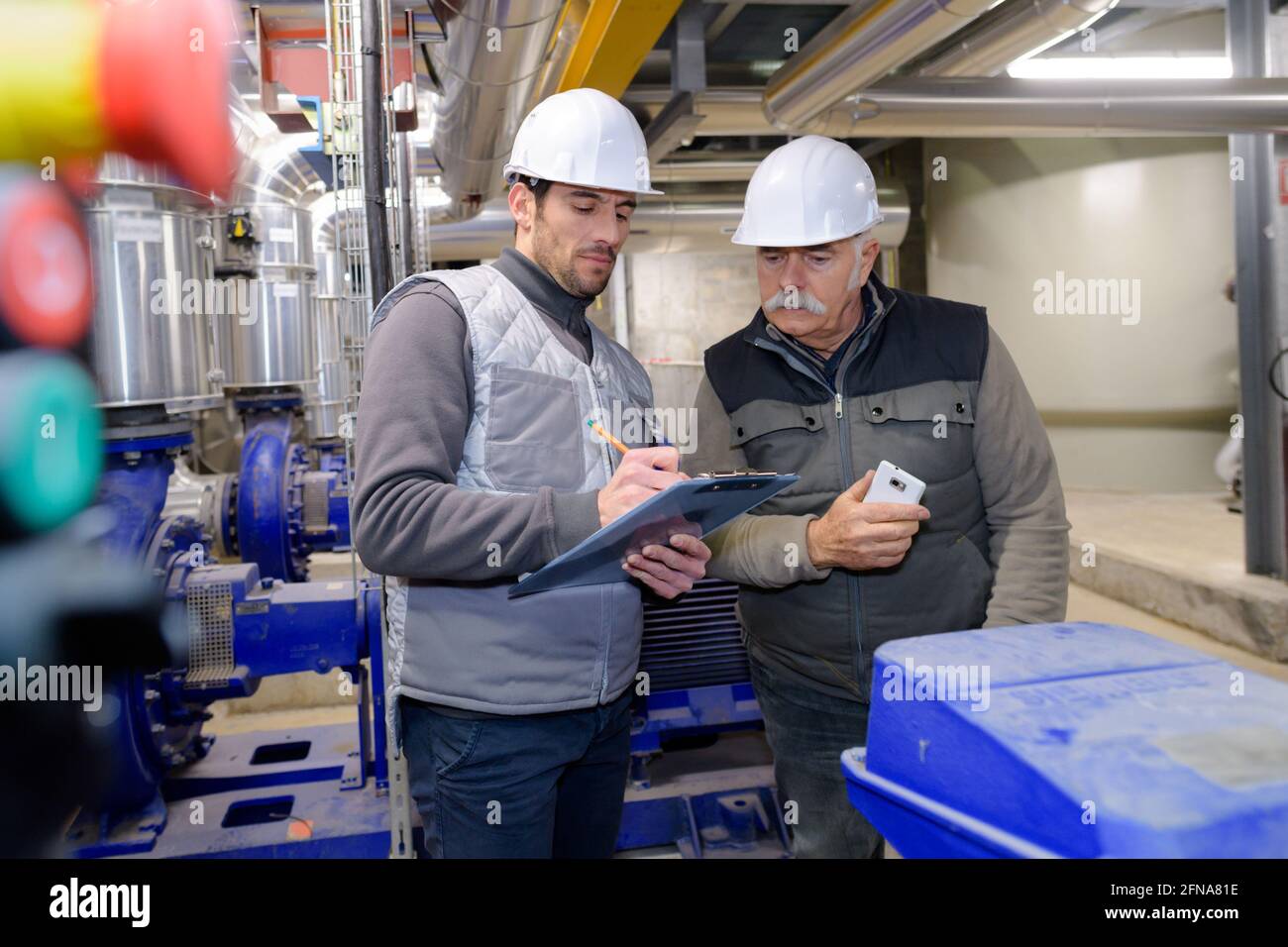 two engineer working in the boiler room Stock Photo - Alamy
