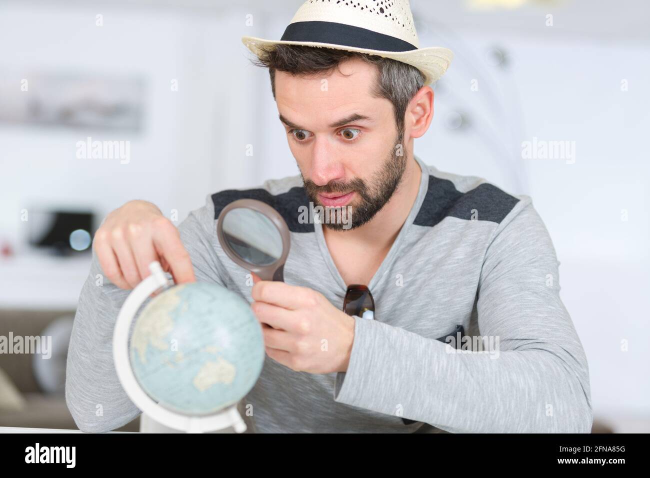 Business man holding atlas globe hi-res stock photography and images ...