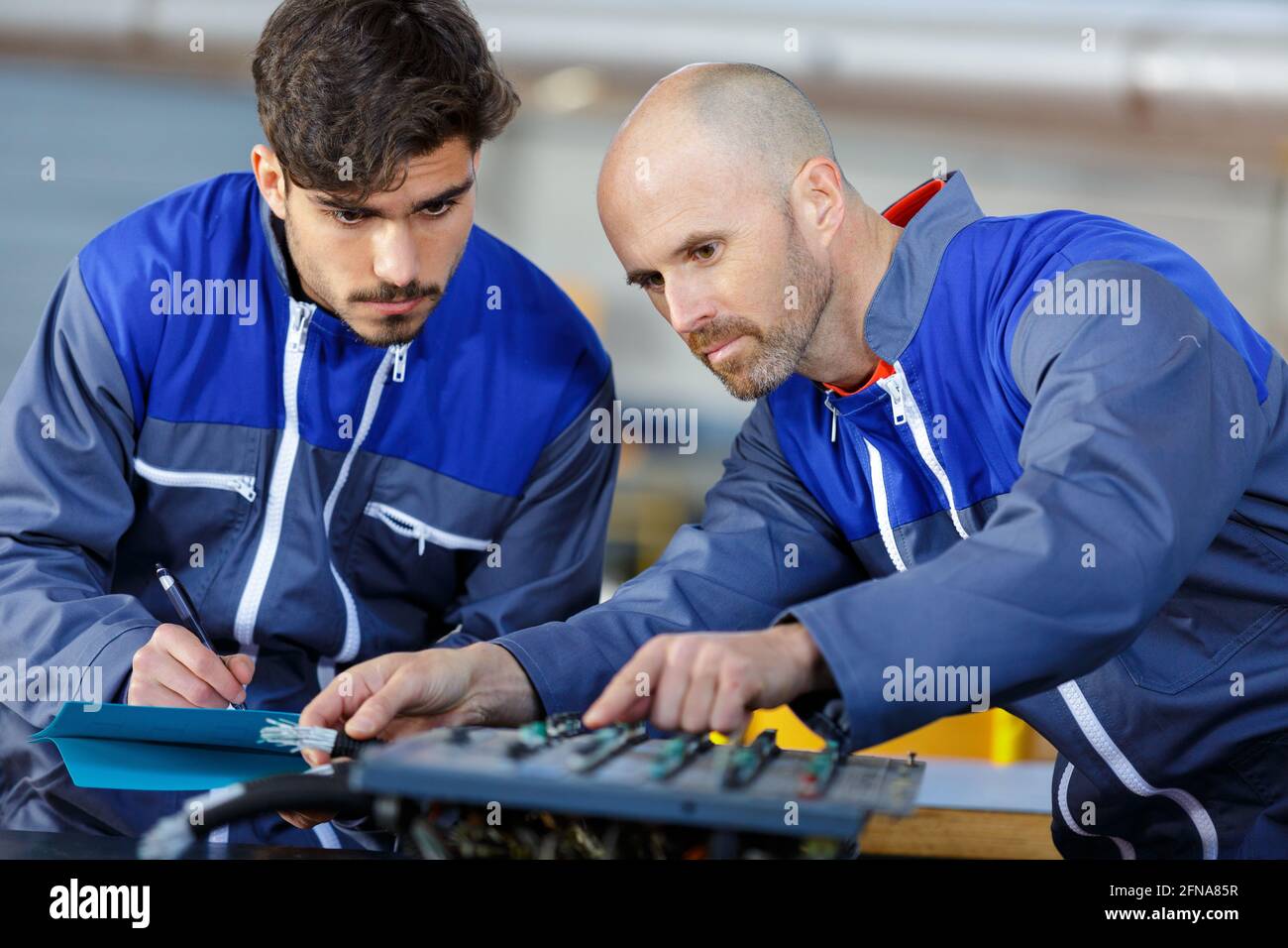 picture of production engineering professionals at work Stock Photo - Alamy