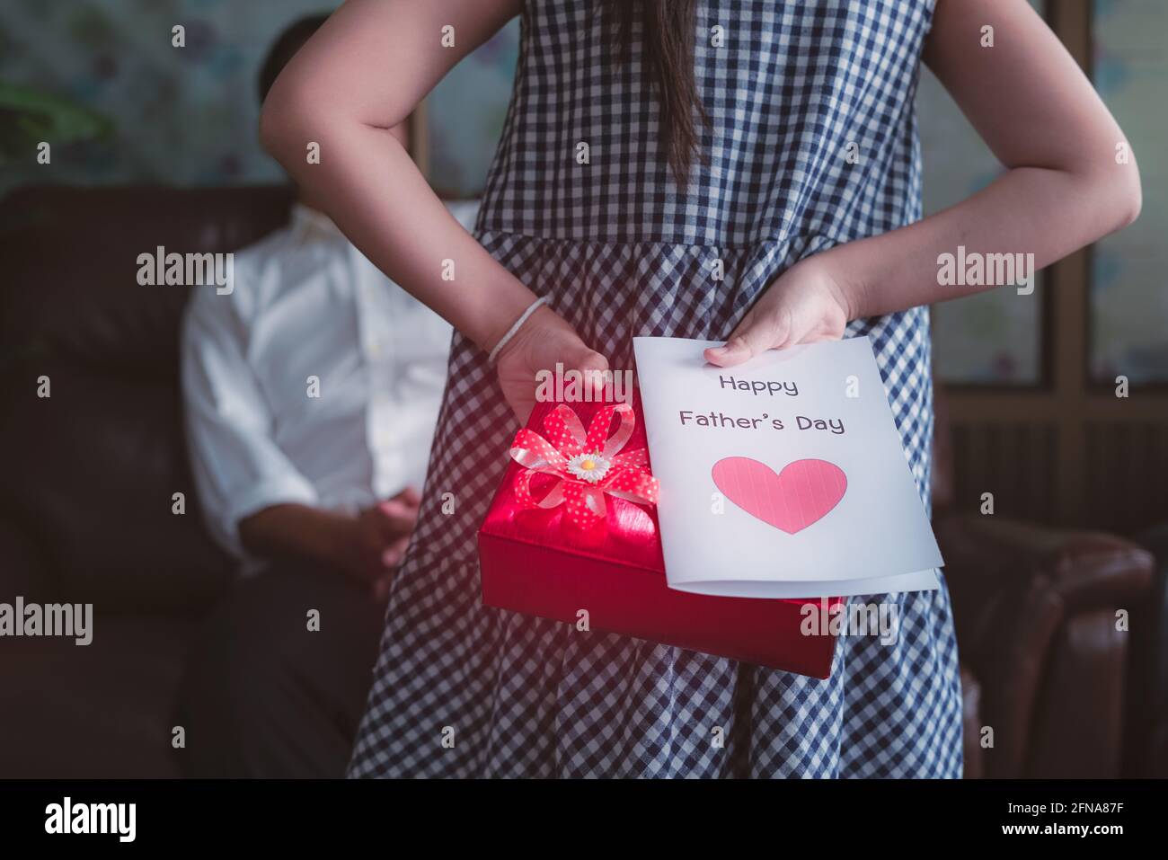 Girl child hiding behind man hi-res stock photography and images - Alamy