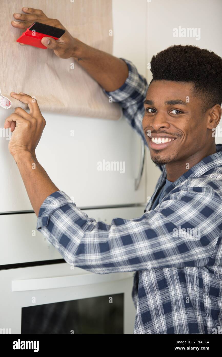 Man working on tile installation hi-res stock photography and images ...