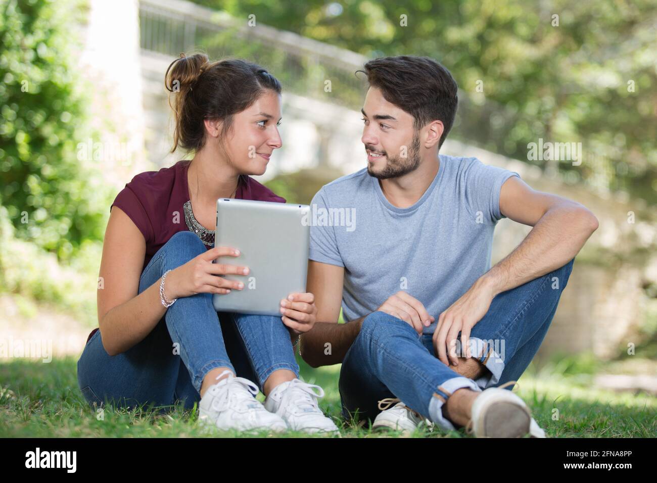 cute uni students studying together in nature Stock Photo - Alamy