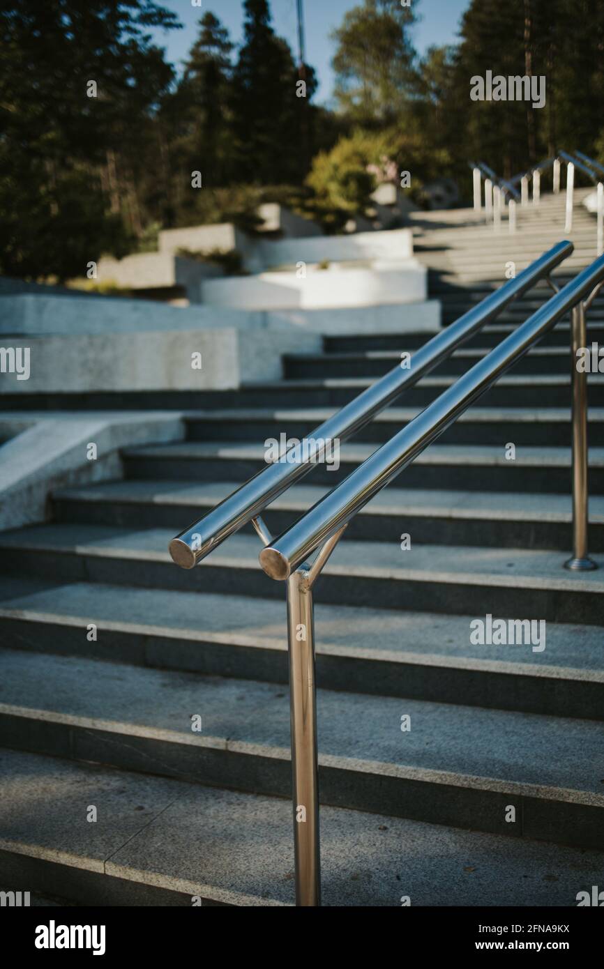 Vertical shot of metallic railings near stairs Stock Photo - Alamy