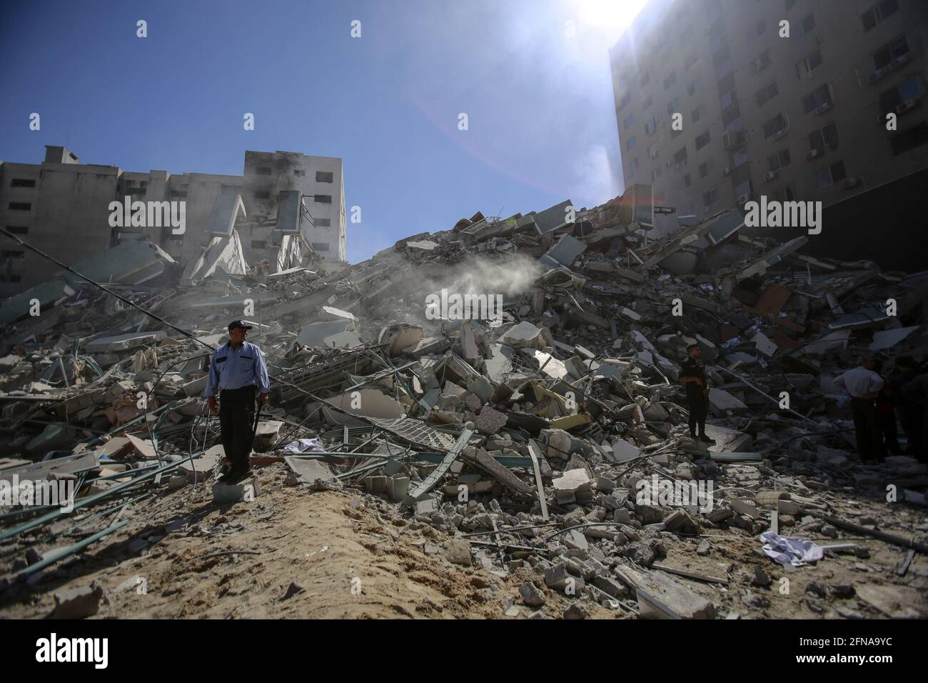Gaza, Gaza. 15th May, 2021. police men stand on to the rubble of Jala ...
