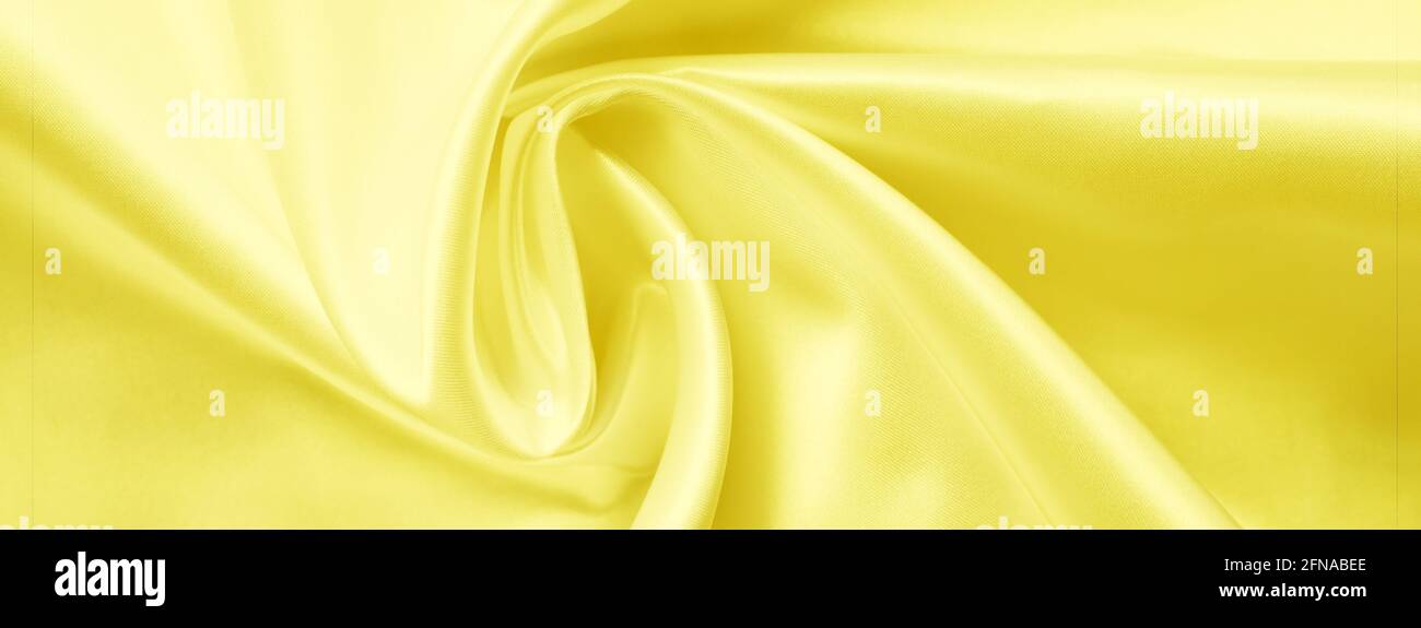 Golden silk fabric texture close up as background. Trending color of ...