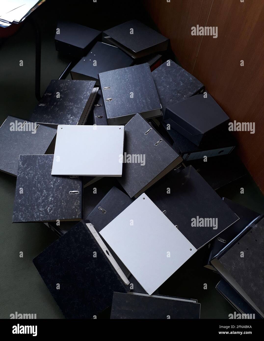empty file folders on the floor of the office Stock Photo - Alamy