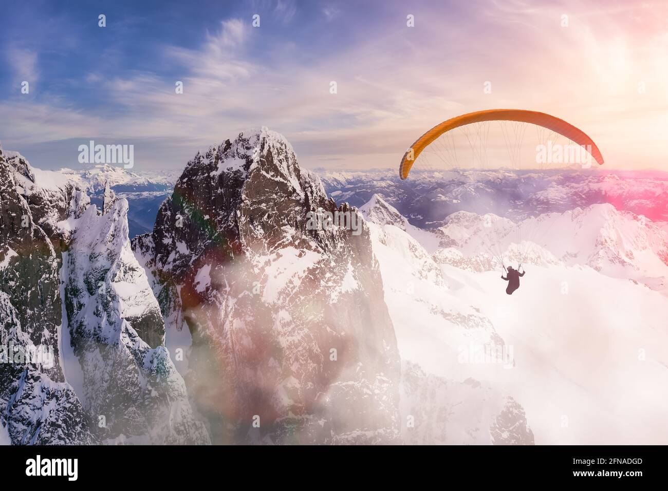 Adventure Composite Image of Paraglider Flying up high in the Rocky ...
