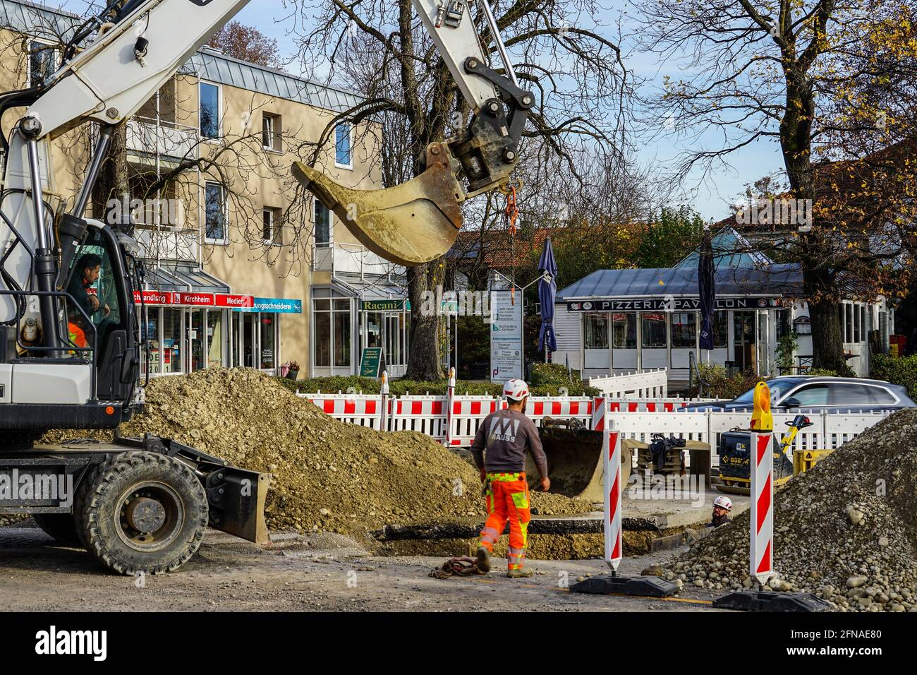 A construction site with numerous red and white warning signs.A ...