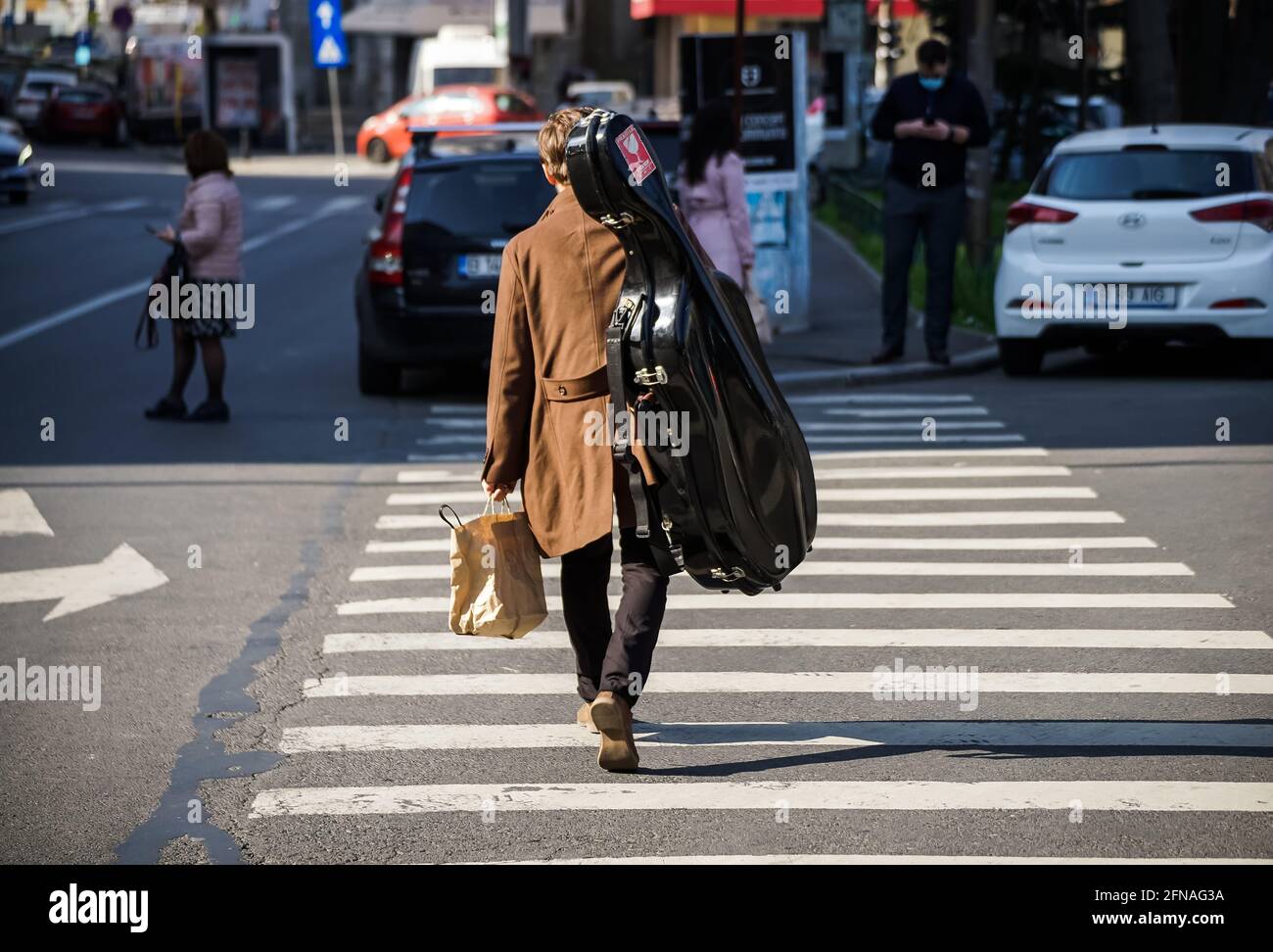 Carrying a cello hi-res stock photography and images - Alamy