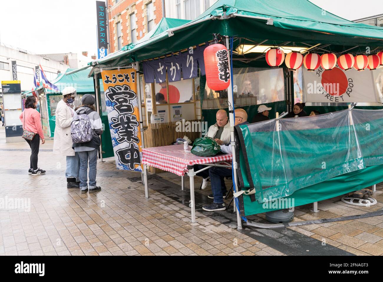 customer enjoy street food at Japanese stall, takeaway store in open ...