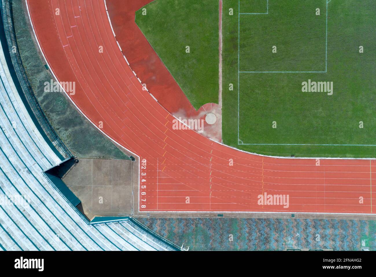 Aerial view of empty green football field with running track, Running ...