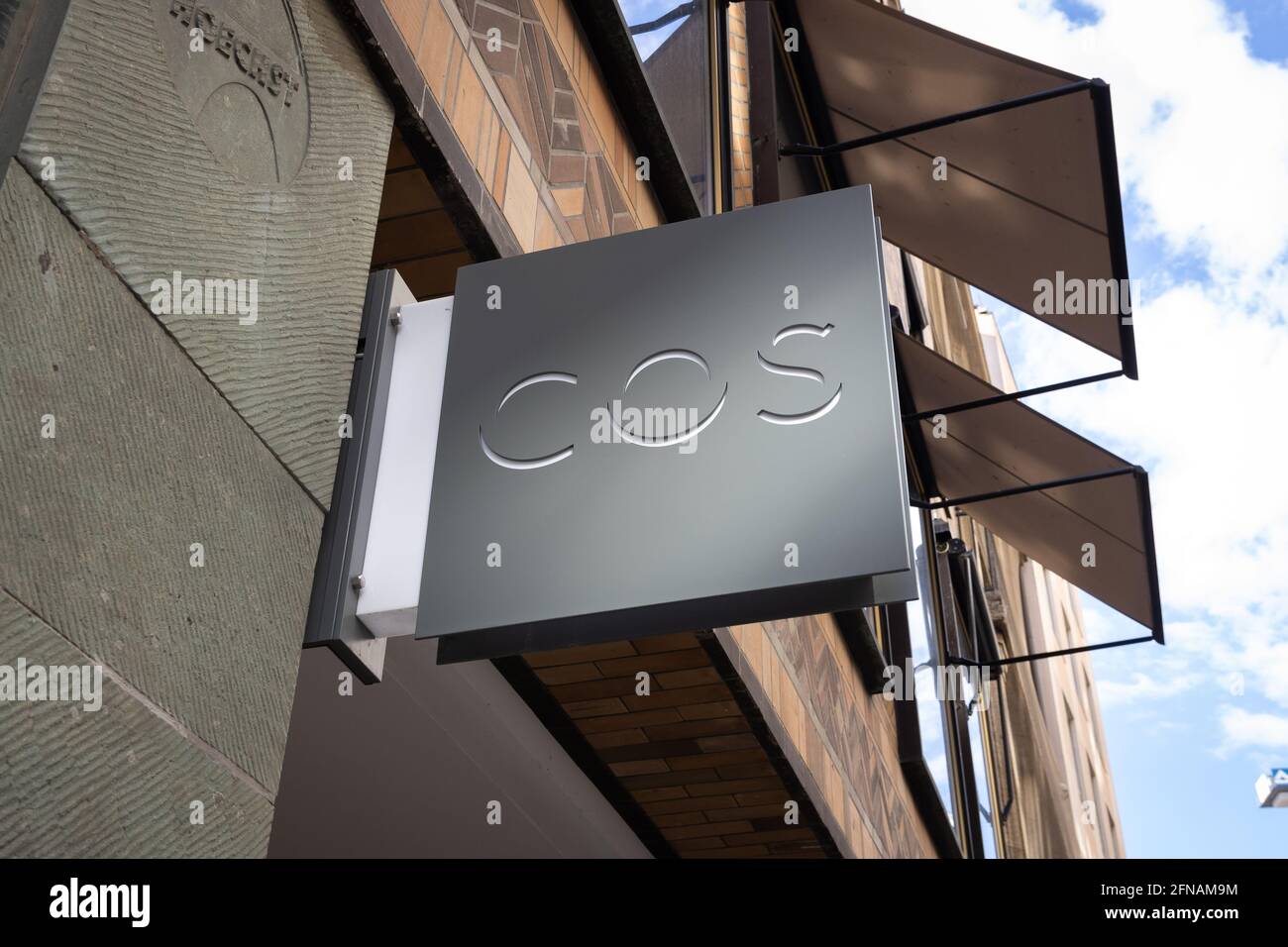 COS store sign in Munich town center Stock Photo - Alamy
