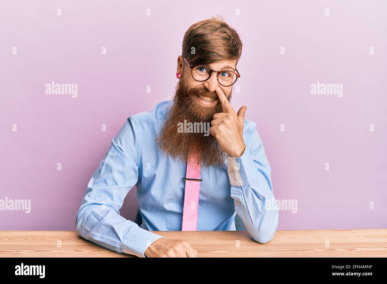 Young irish redhead man wearing business shirt and tie sitting on the ...
