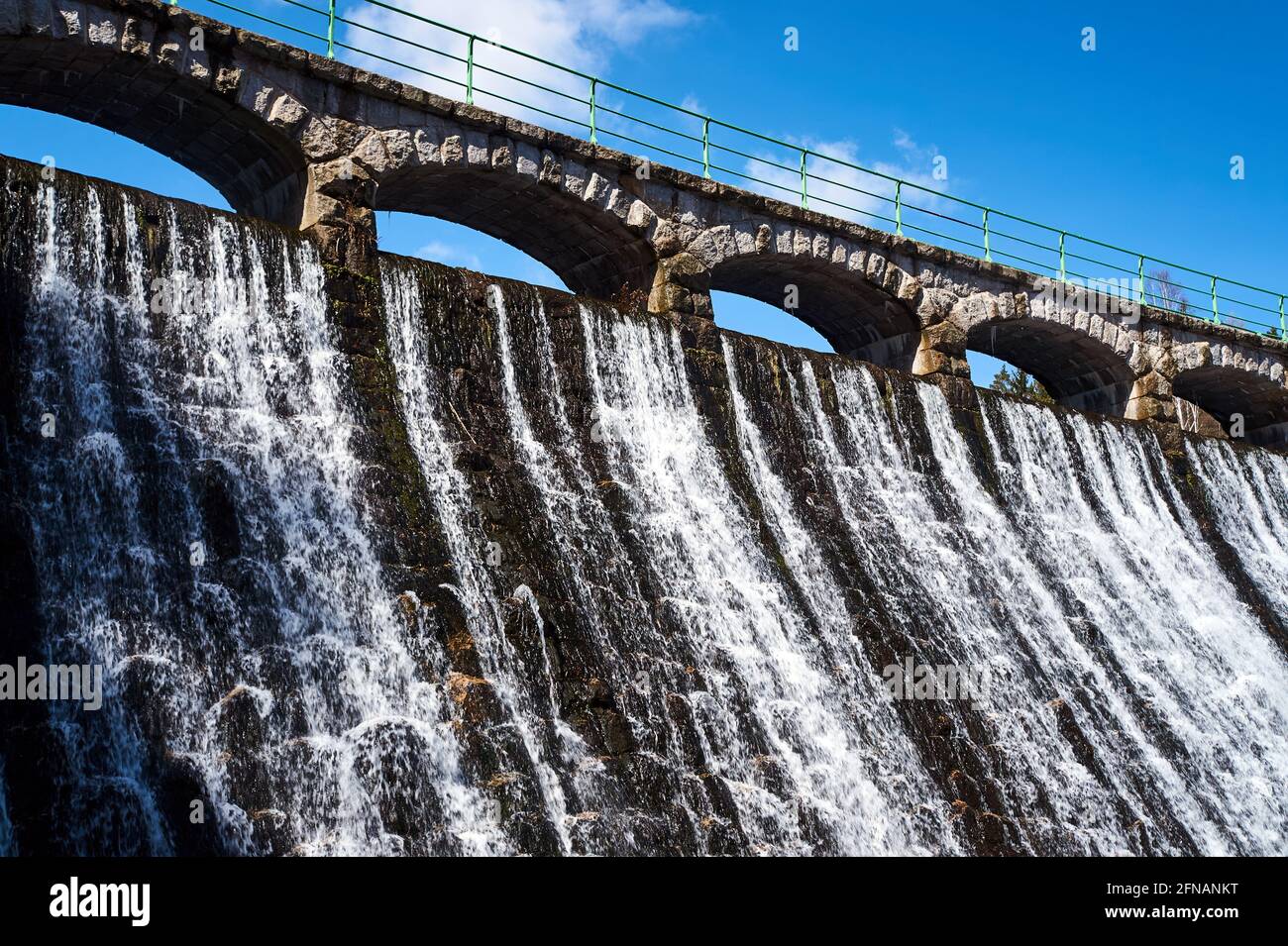The stone dam and waterfall on the river Lomnica in Karpacz Stock Photo ...
