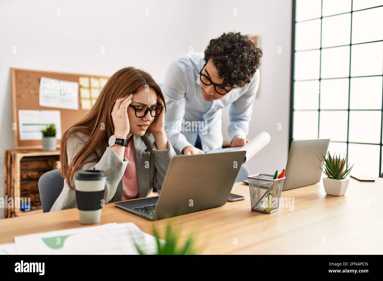 Business boss angry with stressed employee at the office Stock Photo ...