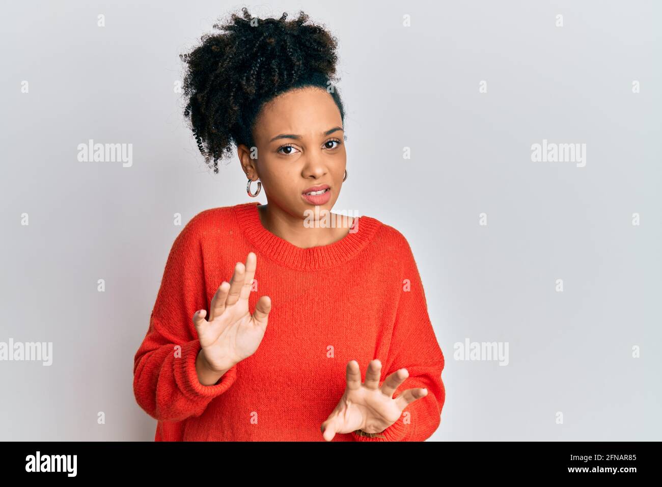 Young african american girl wearing casual clothes disgusted expression ...