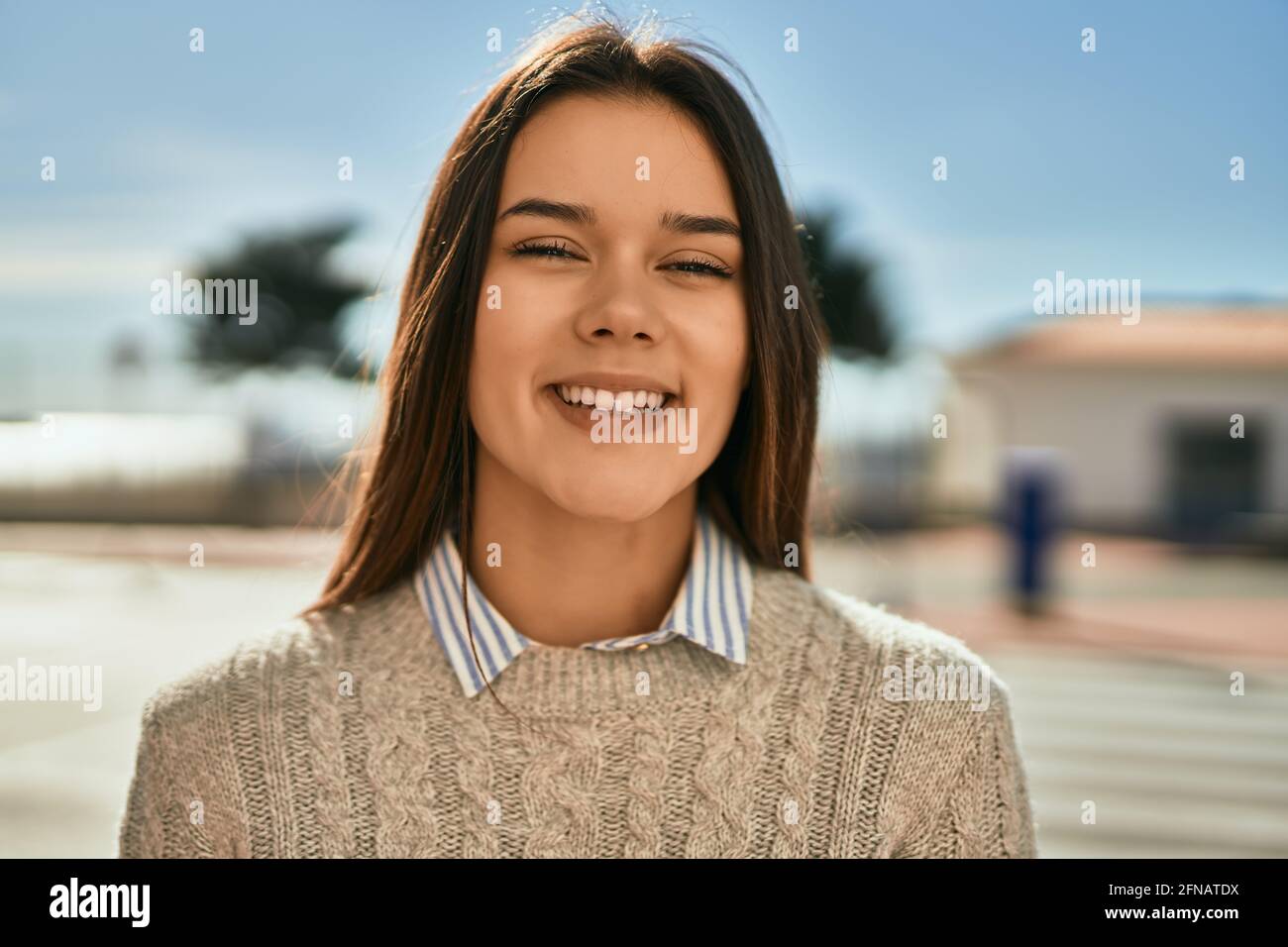 Young hispanic girl smiling happy standing at the city Stock Photo - Alamy