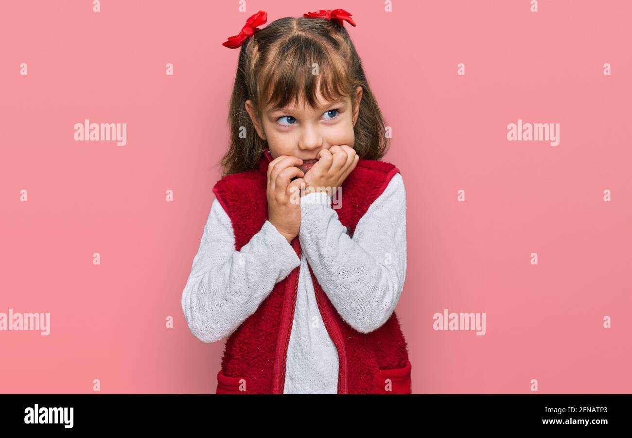 Little caucasian girl kid wearing casual clothes looking stressed and ...