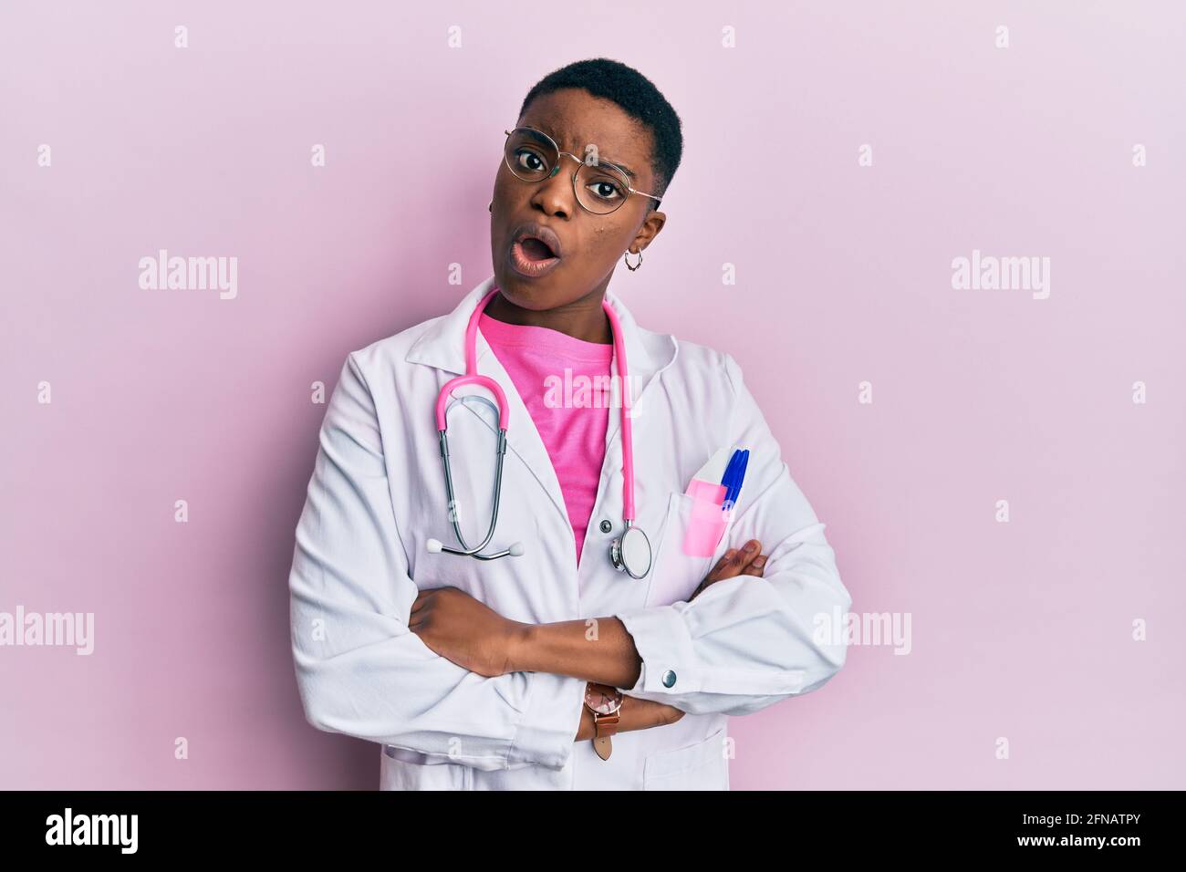 Young african american woman wearing doctor uniform and stethoscope in ...