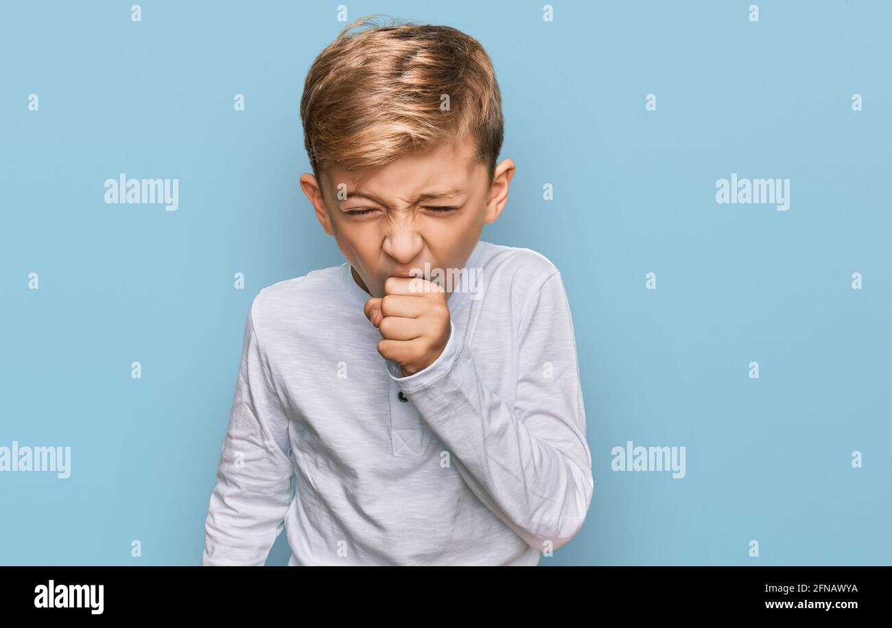 Little caucasian boy kid wearing casual clothes feeling unwell and ...