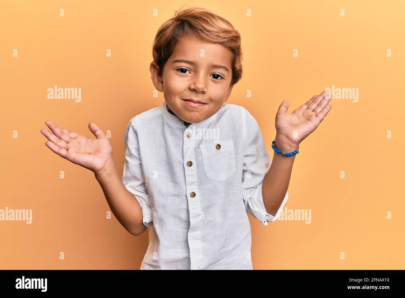Adorable latin kid wearing casual clothes clueless and confused with ...