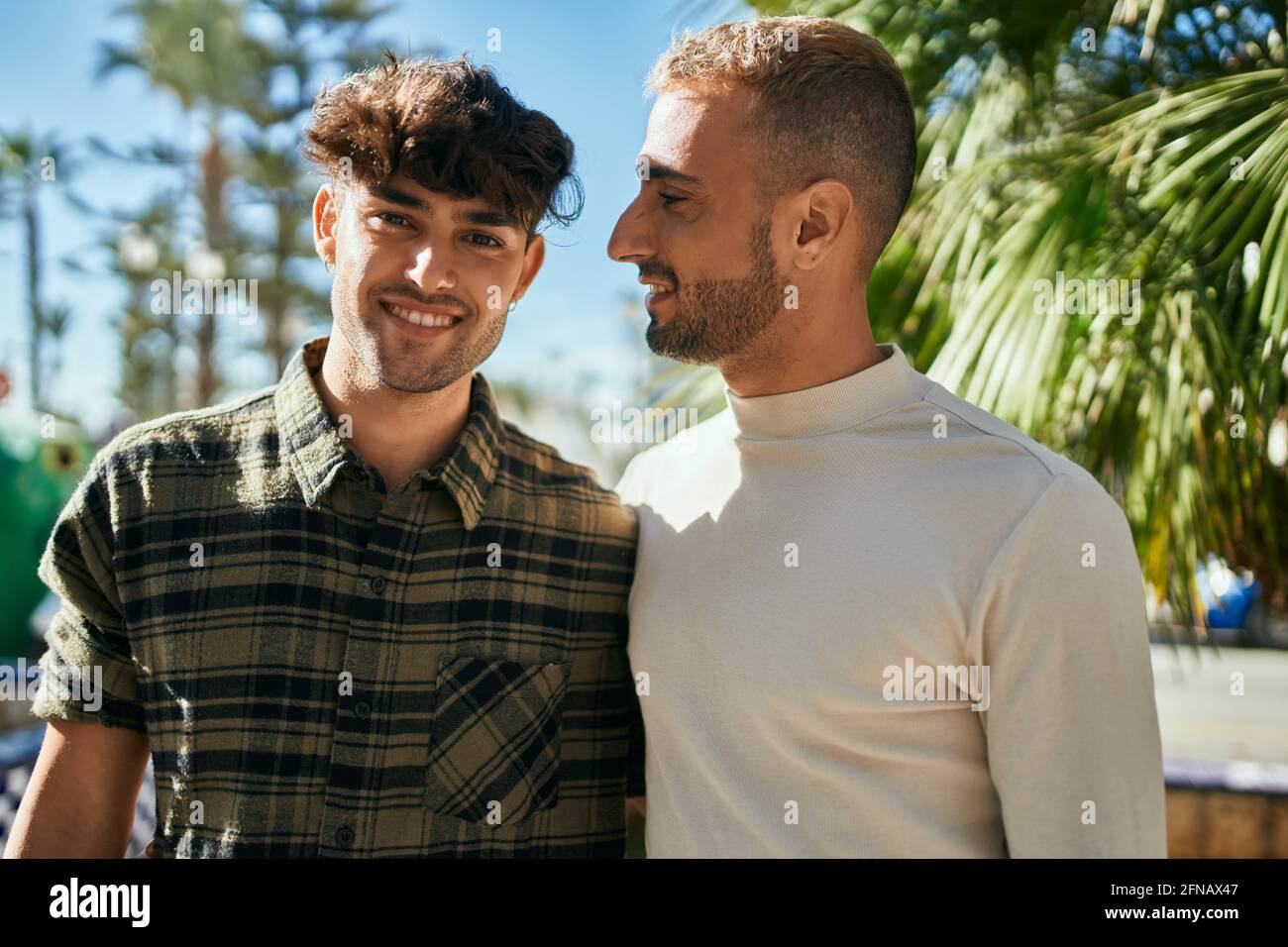 Young gay couple smiling happy and hugging at the city Stock Photo - Alamy