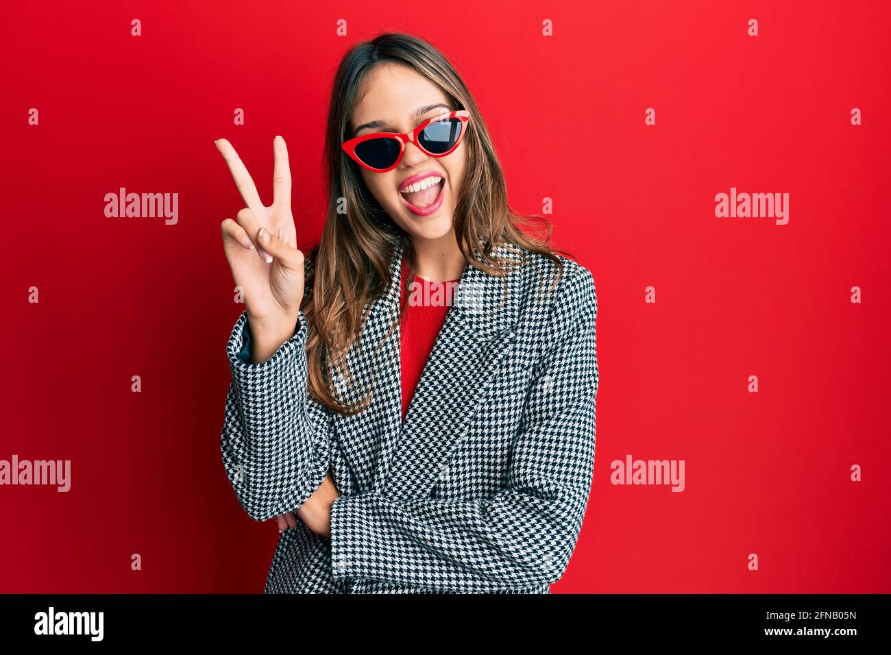 Young brunette woman wearing fashion and modern look smiling with happy ...