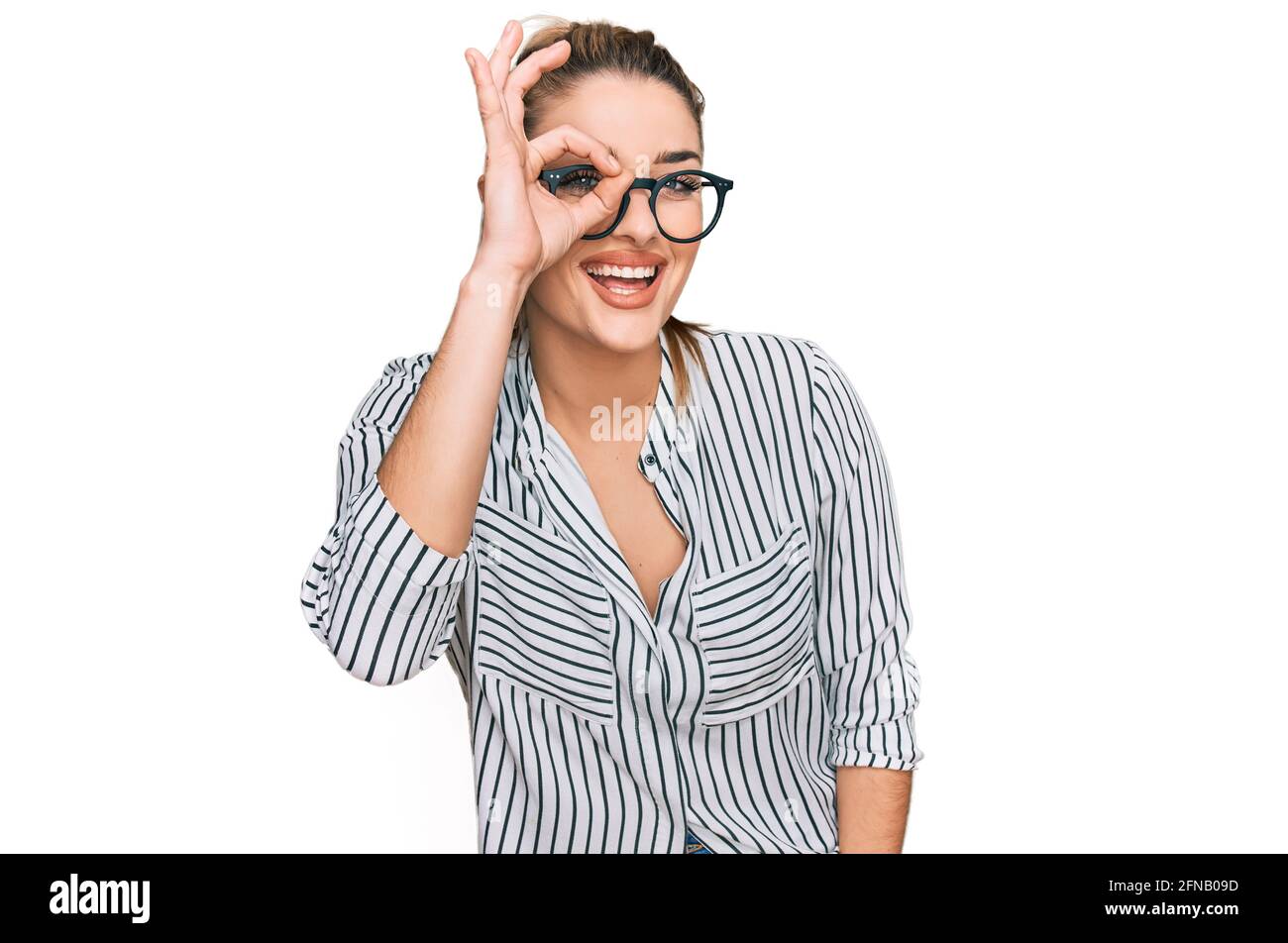 Young caucasian woman wearing business shirt and glasses doing ok ...