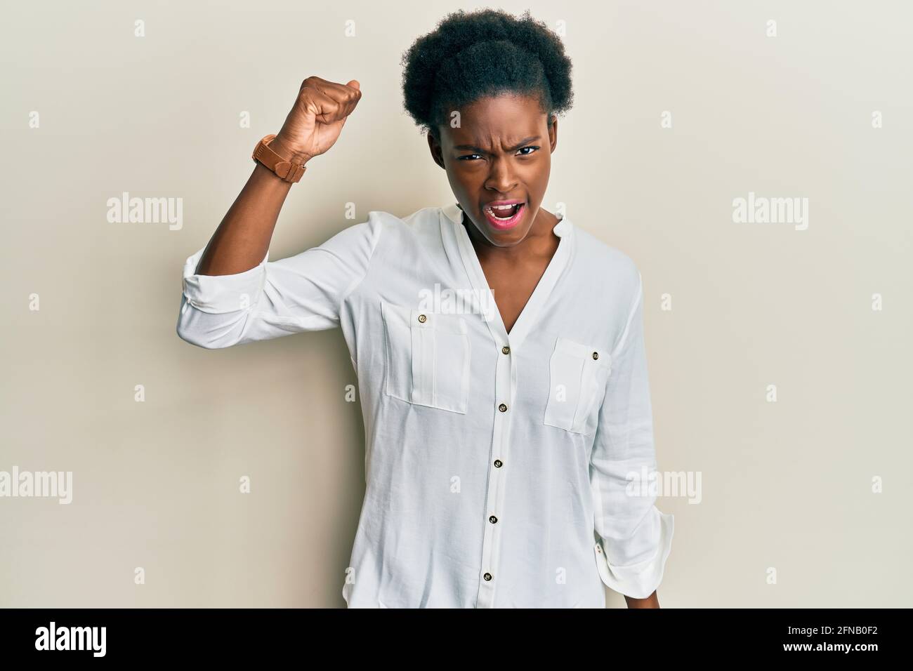Young african american girl wearing casual clothes angry and mad ...