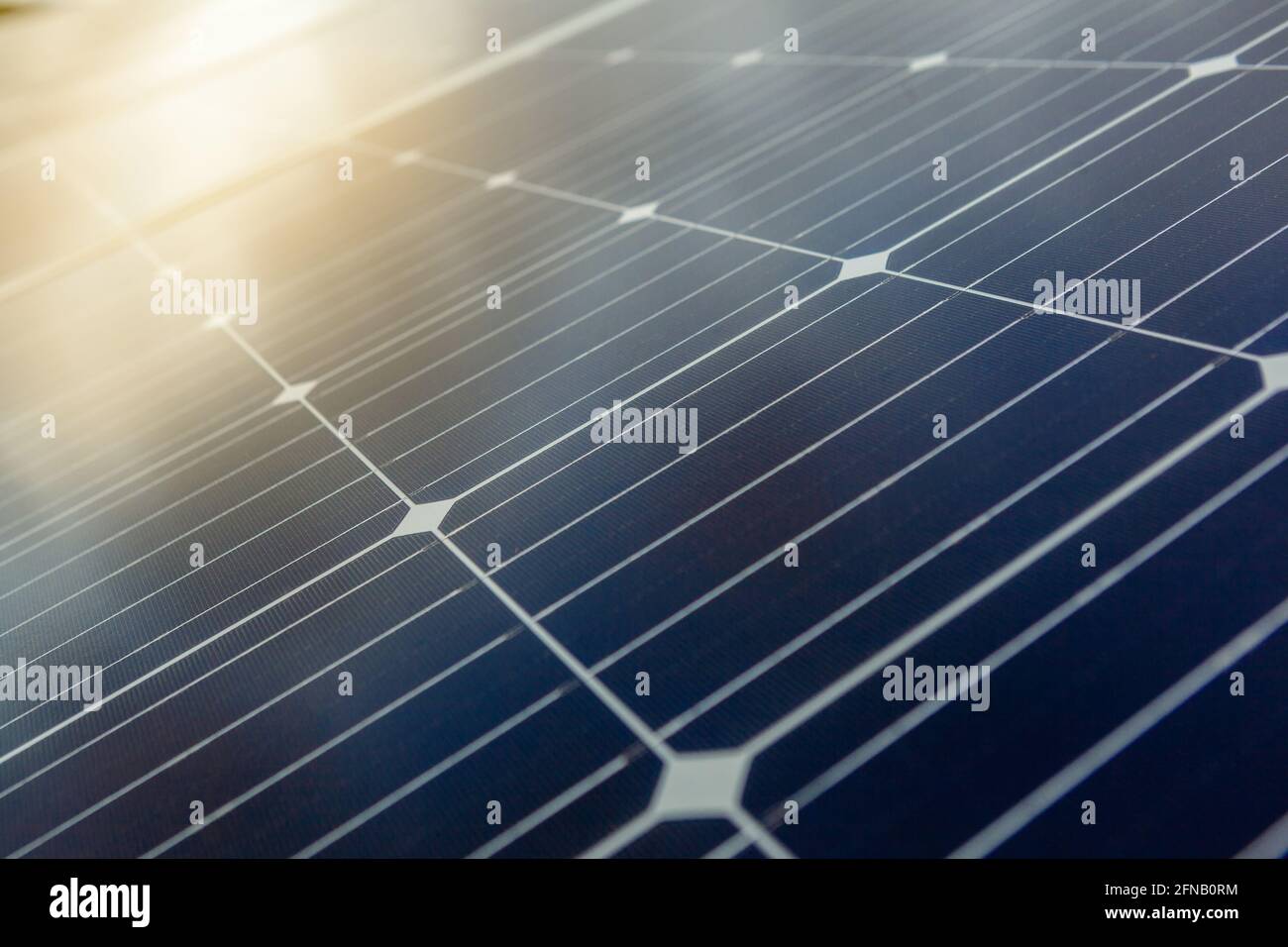 A low angle shot of modern solar panels under the sunlight ...